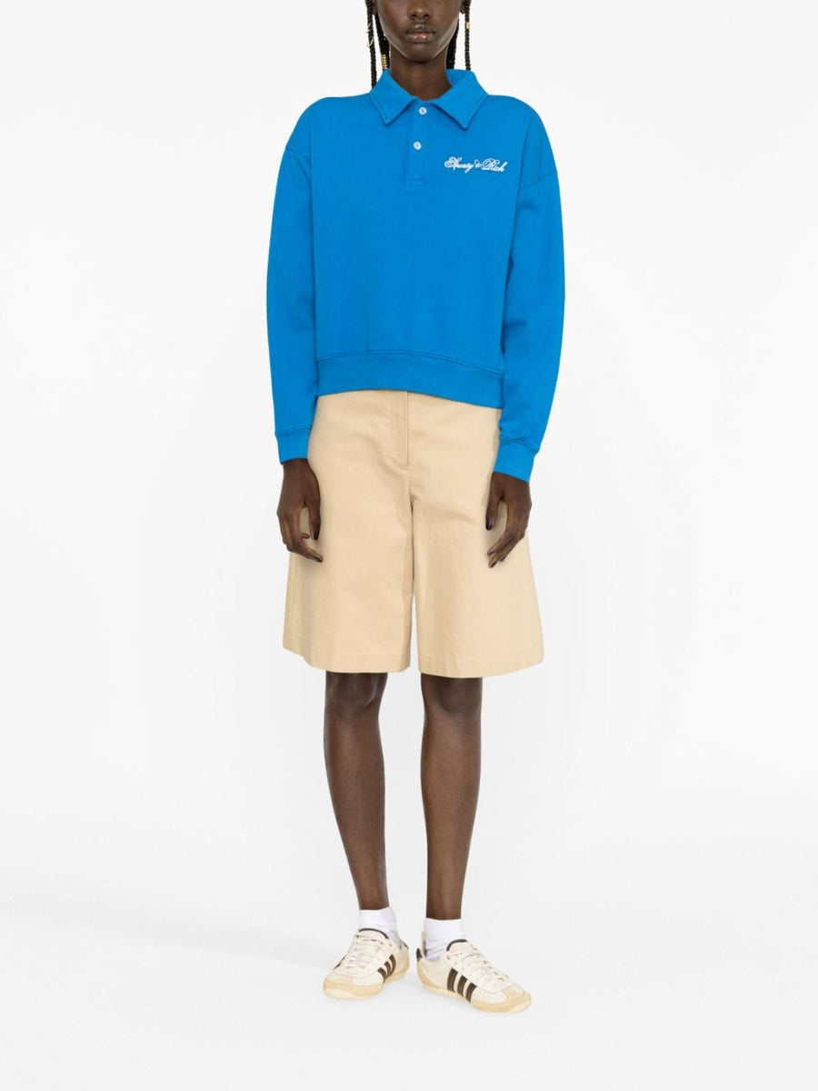 Sporty & Rich Cursive Logo Cotton Polo Shirt | Balardi